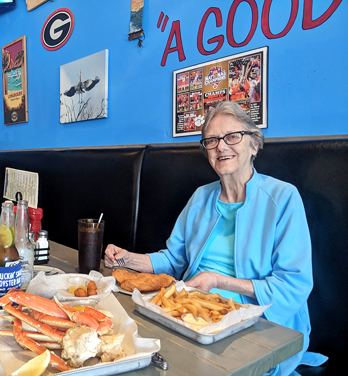 Nothing says "I'm having a good day" like a table full of crab legs and a smile that says "I regret nothing."