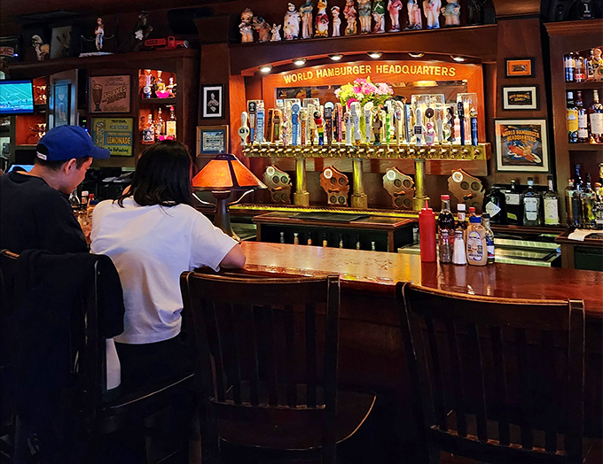 The bar area isn't just serving drinks—it's serving community. "World Hamburger Headquarters" isn't just clever marketing; it's their mission statement. 