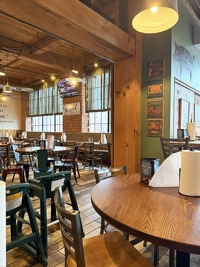 Rustic wooden beams, natural light, and tables arranged for conversation—the dining room feels like a BBQ enthusiast's living room.