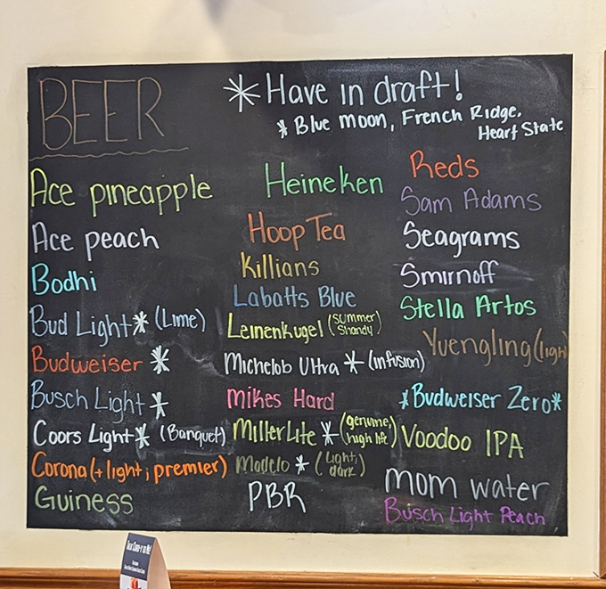 The drink menu chalkboard offers everything from craft beers to simple domestics—proving The Hangout knows its audience isn't defined by just one taste.