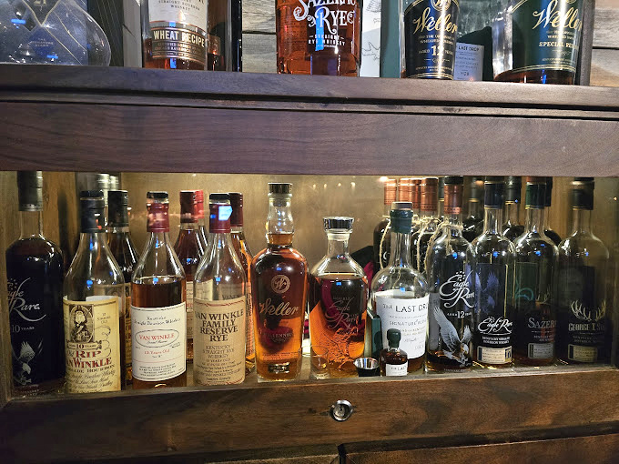 A whiskey collection that would make bourbon country proud. These bottles aren't just decoration—they're liquid personality waiting to be poured.