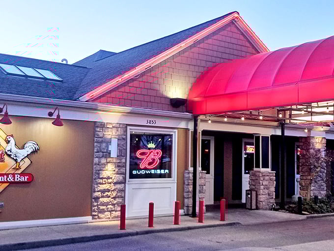 As dusk settles, Ron's Roost glows with promise—that red awning isn't just an entrance, it's a portal to flavor country.