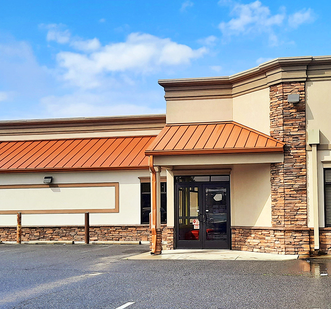 The entrance promises what every hungry traveler seeks – shelter from the storm of an empty stomach. 
