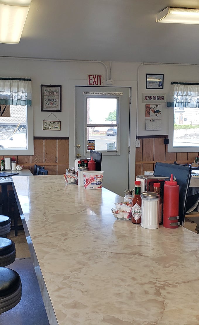 The counter view reveals the essentials of diner life: sugar, ketchup, and Tabasco—the holy trinity of breakfast condiments.