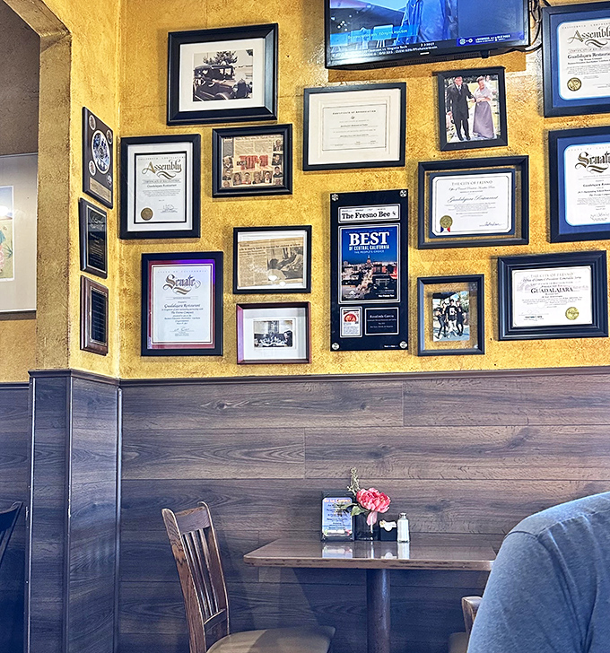 The wall of accolades isn't just decoration—it's a timeline of community love and recognition that speaks louder than any social media influencer could.