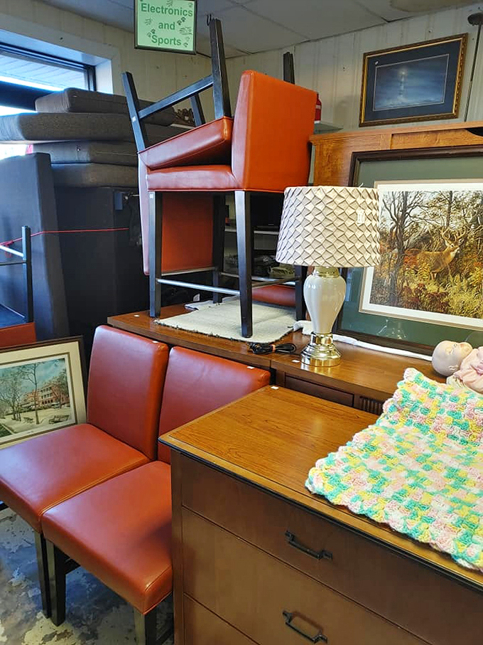 Mid-century meets modern in the furniture corner. Those orange vinyl chairs have seen things—and they're ready to see your living room next.