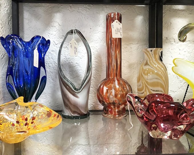 Art glass that catches light like liquid rainbows – each piece a testament to craftsmanship that transforms ordinary materials into extraordinary beauty.