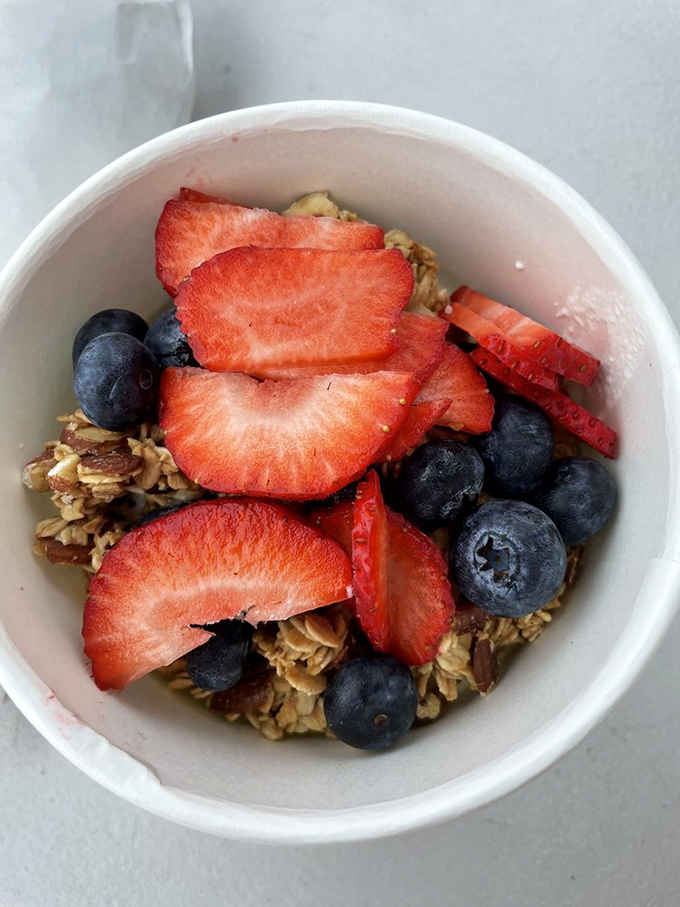 A simple bowl of granola, berries, and possibility—proof that sometimes the best breakfast doesn't need to be complicated.