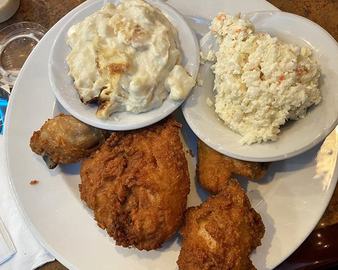 Southern fried chicken with all the fixings—proof that comfort food is actually a warm, crispy hug for your soul.