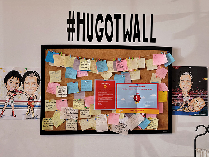 The "Hugot Wall" where diners leave notes of appreciation—like a analog Facebook where every review comes with actual human handwriting.