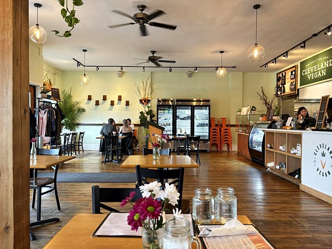 The dining room balances rustic charm with modern sensibility, where pendant lights cast a glow that makes everyone look like they're in a feel-good indie film.
