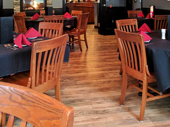 Warm wood tones and vibrant red napkins—the dining room where "I'll just try one bite of yours" becomes a delicious lie.