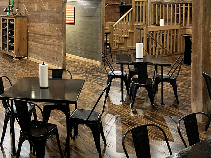 Simple black chairs and wooden tables that know their role: stay out of the way and let the barbecue be the star of this show.