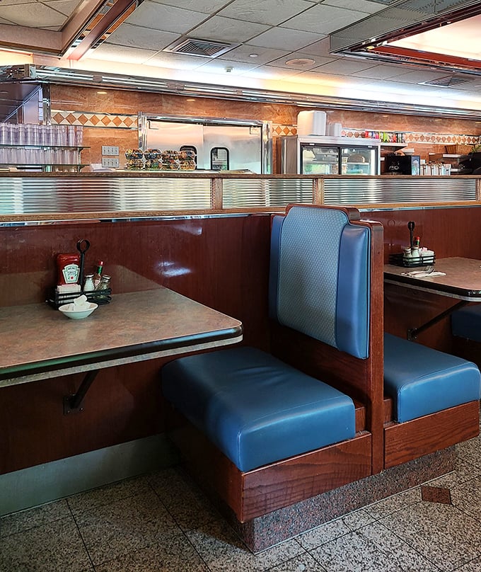 The booth—that sacred space where countless conversations, first dates, and family meals have unfolded over decades of Lancaster Avenue history.