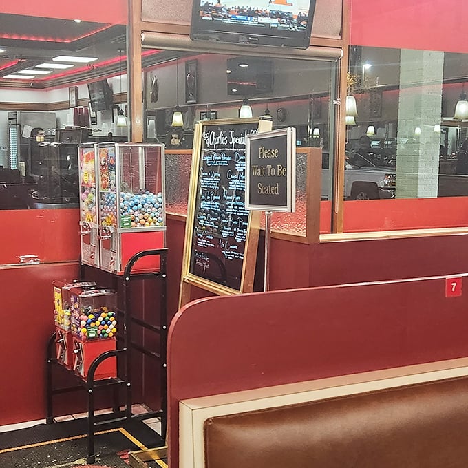 Old-school charm meets practical comfort – candy machines for the kids and "Please Wait to Be Seated" signs for the grown-ups who appreciate order.