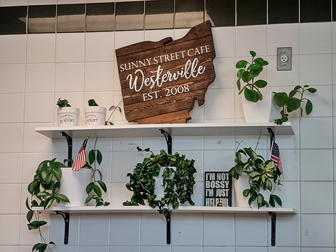 Wall decor that says "we're serious about breakfast" while plants remind you that vegetables exist, theoretically.