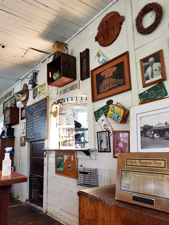 Every inch of wall space tells a story—vintage signs, local memorabilia, and photographs creating a museum of Southern nostalgia.
