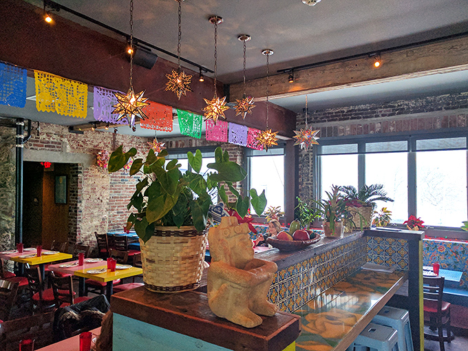 Colorful papel picado and warm lighting transform dinner into a celebration worth extending indefinitely tonight.