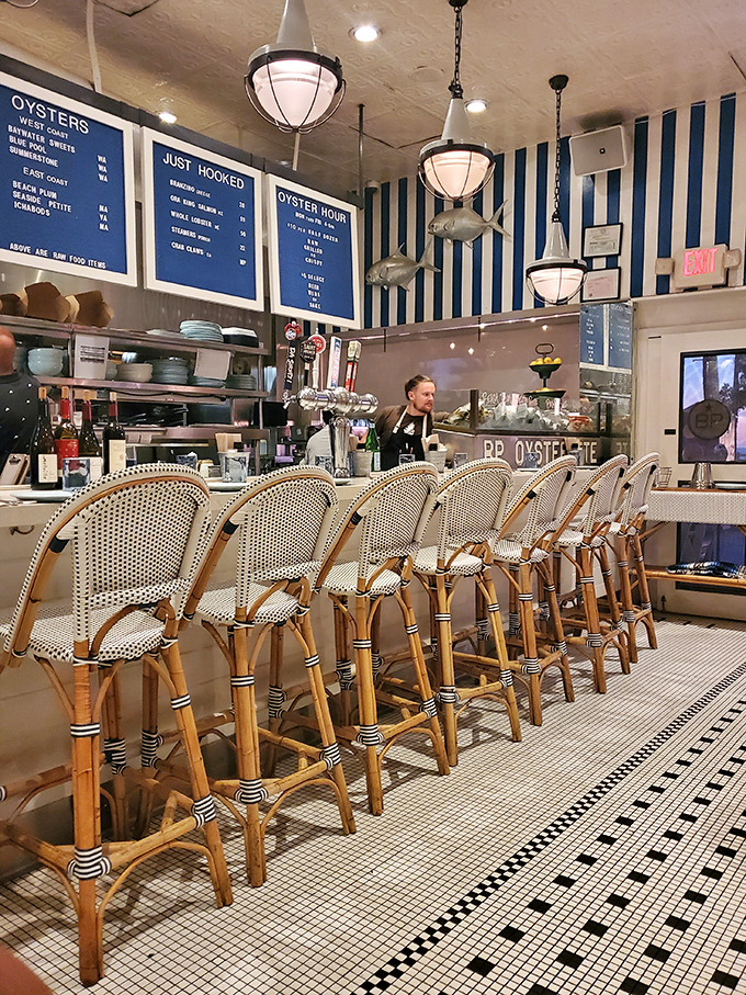 The bar area invites you to pull up a stool and watch the ballet of oyster shucking while contemplating life's important questions—like "one dozen or two?"