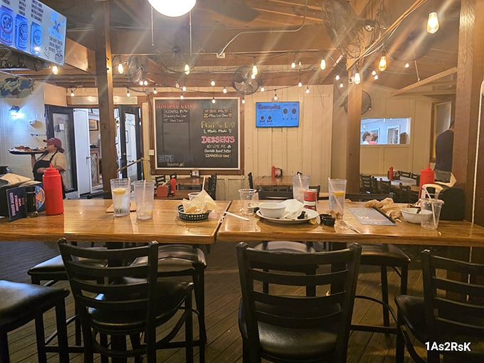 String lights, wooden tables, and that relaxed vibe where nobody's checking their watch – the dining room feels like a coastal living room.