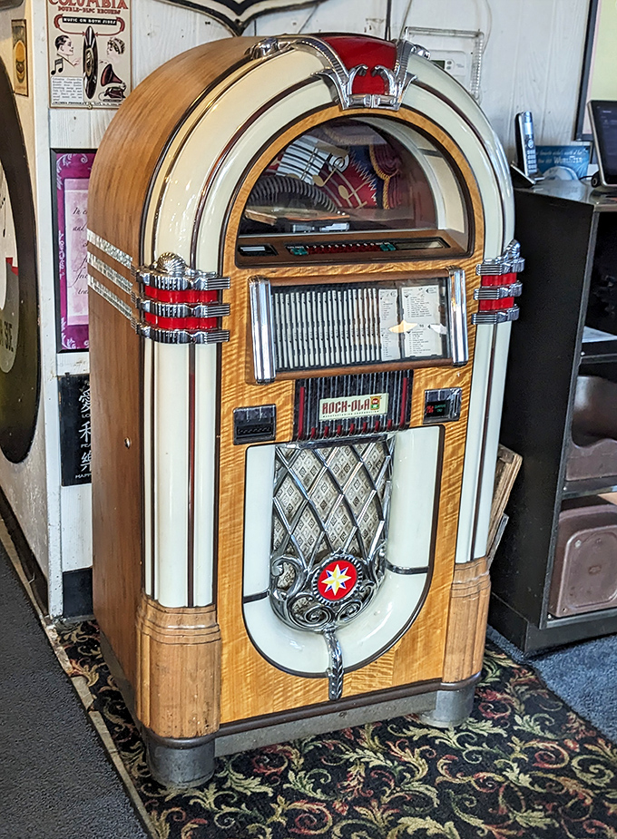Not just any jukebox – a time machine disguised as a Wurlitzer, ready to transport you to simpler times with the press of a button.
