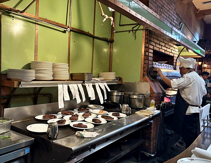 Where the magic happens – chefs work their culinary craft in a kitchen that's been turning out legendary steaks and classics since Hollywood's golden age.