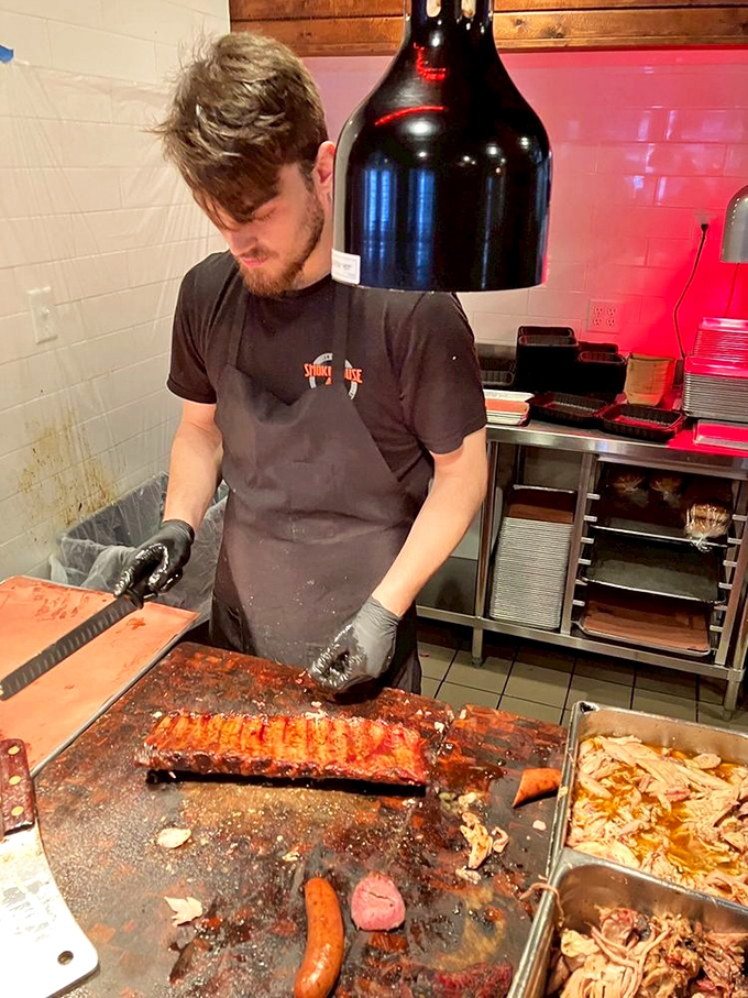 Behind the scenes magic where smoke meets meat. This pitmaster's hands should be insured like a concert pianist's—they're creating edible symphonies. 