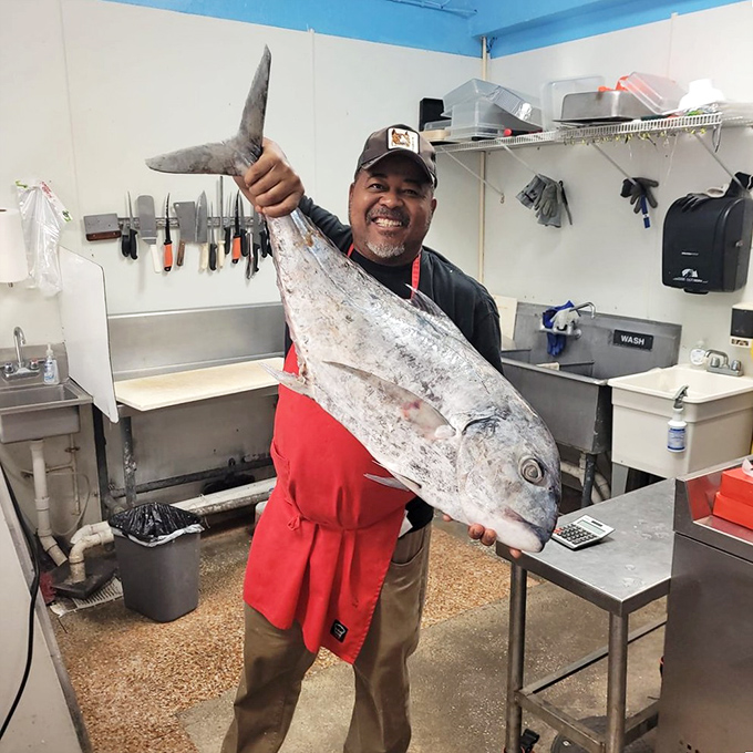 Behind great food stands someone who knows their way around fresh ingredients. That fish isn't just big—it's tomorrow's special waiting to happen.