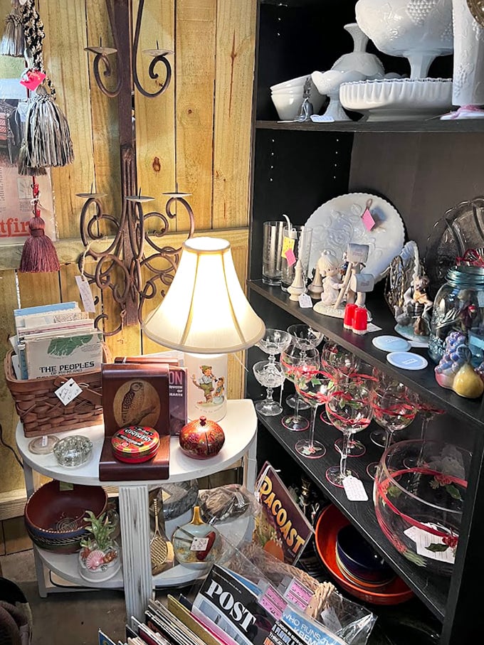 Milk glass treasures share space with crystal stemware, while vintage magazines below remind us what people read when these glasses were new.