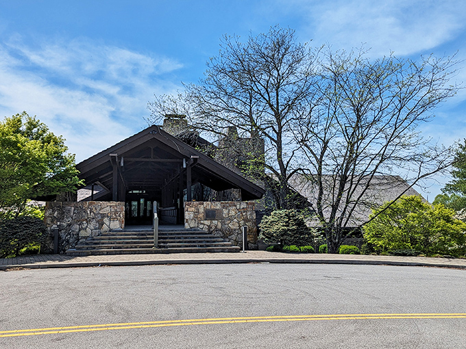 Salt Fork Lodge rises from the landscape like a rustic cathedral, its stone facade promising comfort after a day of outdoor adventures.