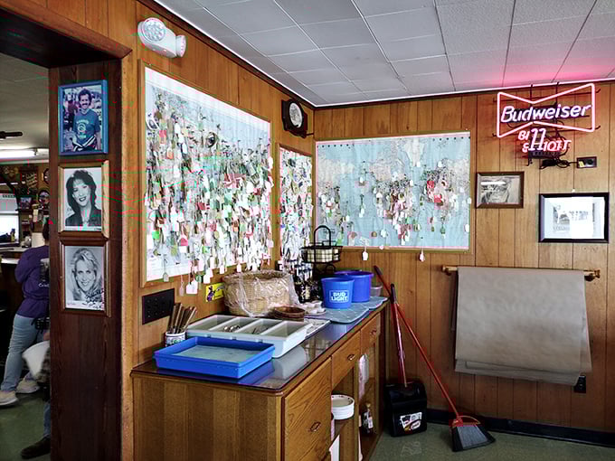 Business cards and memories cover the walls, creating a mosaic of satisfied customers from near and far.