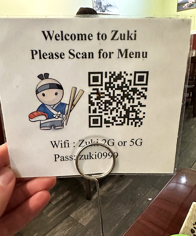 Modern meets traditional with this QR code menu system. That little cartoon sushi chef is basically saying, "Trust me, you're gonna love this place."