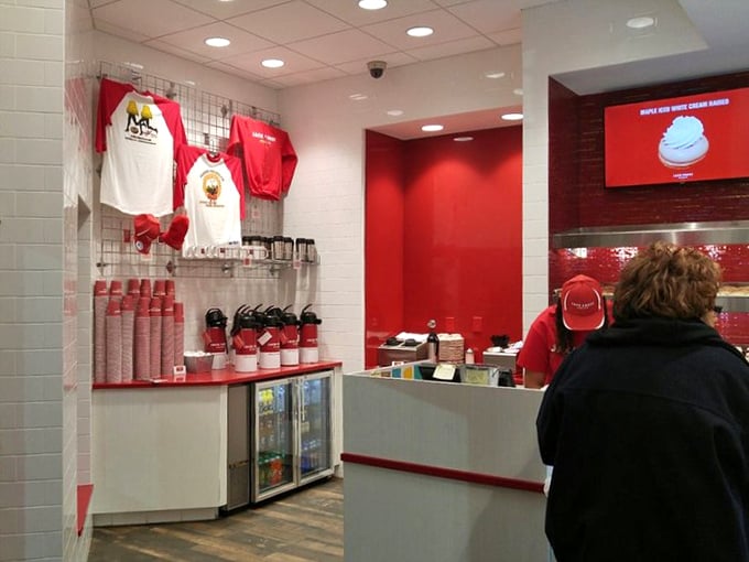 Even the merchandise corner maintains the signature red and white color scheme – because true fans want to wear their donut allegiance.