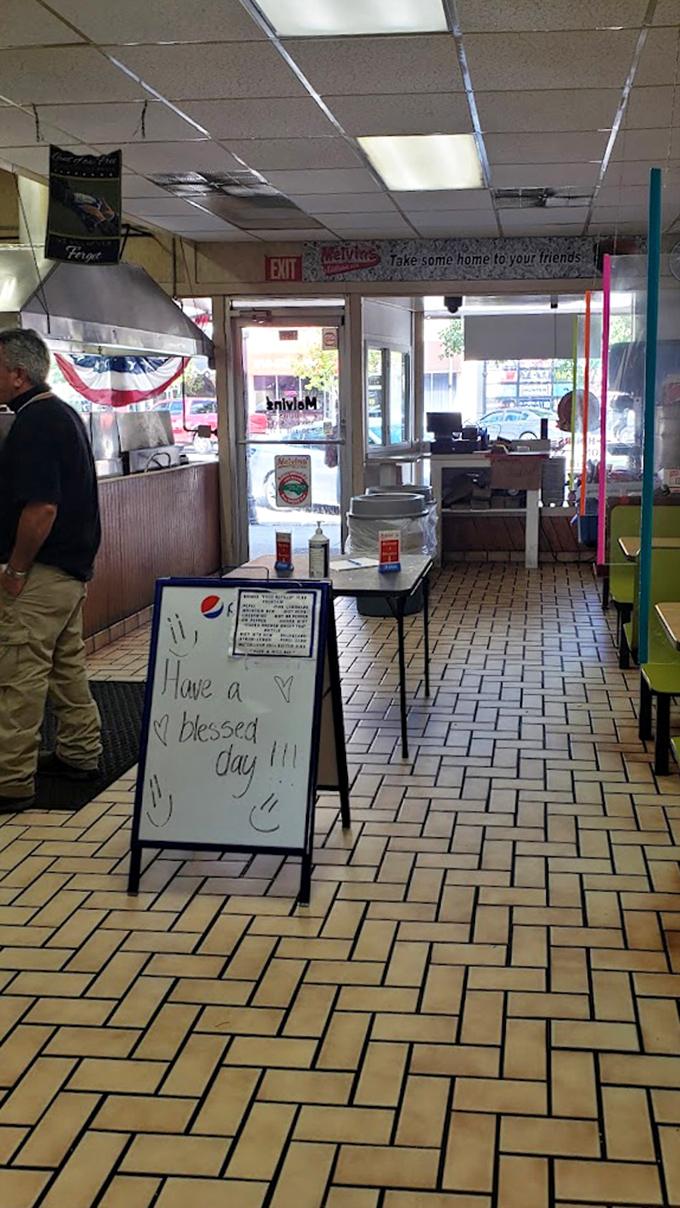 "Have a blessed day!" The handwritten sign says everything about Melvin's philosophy: food for the body, warmth for the soul.