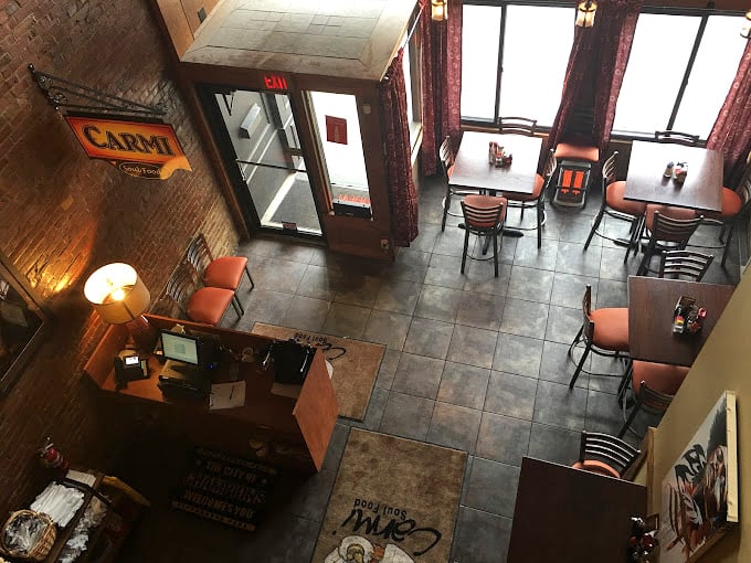 The view from above reveals Carmi's thoughtful layout—intimate enough for conversation, spacious enough to accommodate your food coma.
