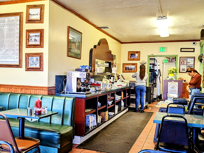 Classic diner booths in that perfect shade of turquoise—where countless cups of coffee have fueled conversations both profound and profoundly silly.