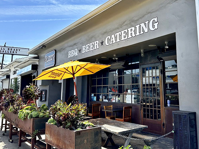 The outdoor patio offers a sunny spot to enjoy your barbecue feast while watching La Brea Avenue life unfold—urban dining with Texas soul.