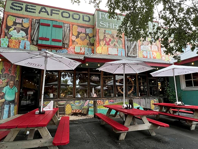 Outdoor seating that says "come as you are" – sandy flip-flops welcome. Those red picnic tables have hosted more happy meals than any fast food chain.
