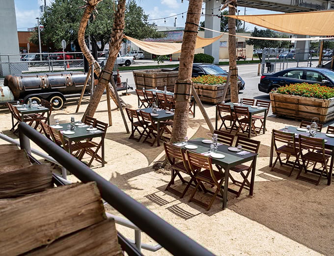 Al fresco dining under palm trees and sail shades – because barbecue tastes even better with a side of vitamin D.