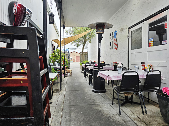 Even the outdoor seating area maintains the diner's charm – red checkered tablecloths and patio heaters create a cozy breakfast oasis.