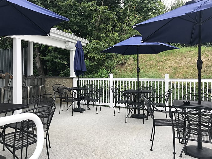 Outdoor dining Pennsylvania-style. Those blue umbrellas aren't just for show – they're protecting your perfect meal from nature's enthusiasm.