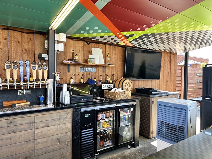 The outdoor bar area—where summer memories are crafted one tap pull at a time. Wood paneling never looked so inviting.