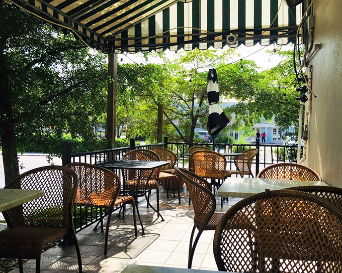 The daytime patio offers dappled sunshine through the trees—nature's Instagram filter for your lunch experience.
