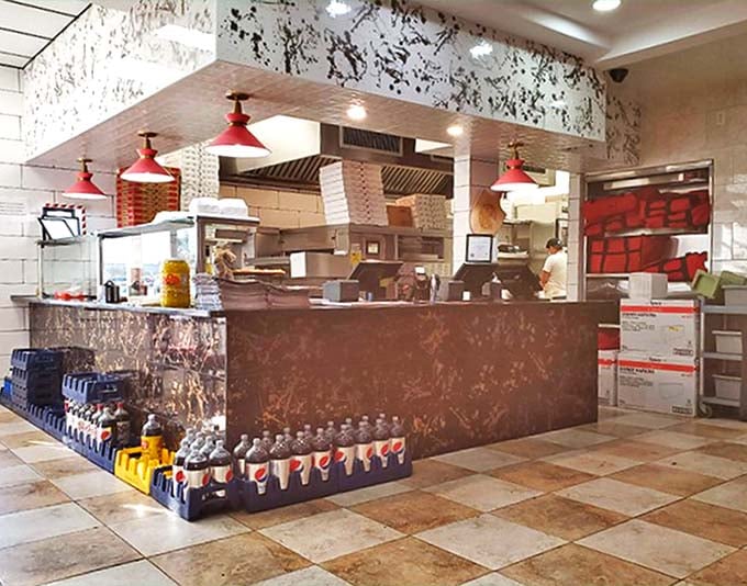 Behind this counter, breakfast magic happens around the clock – where 3 AM pancakes are as normal as noon.