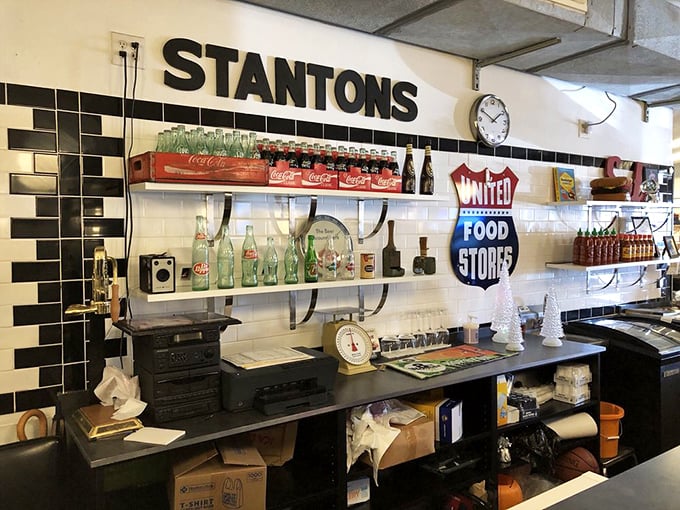 Vintage Coca-Cola memorabilia meets modern-day burger joint. This isn't decoration—it's a timeline of American comfort food evolution.