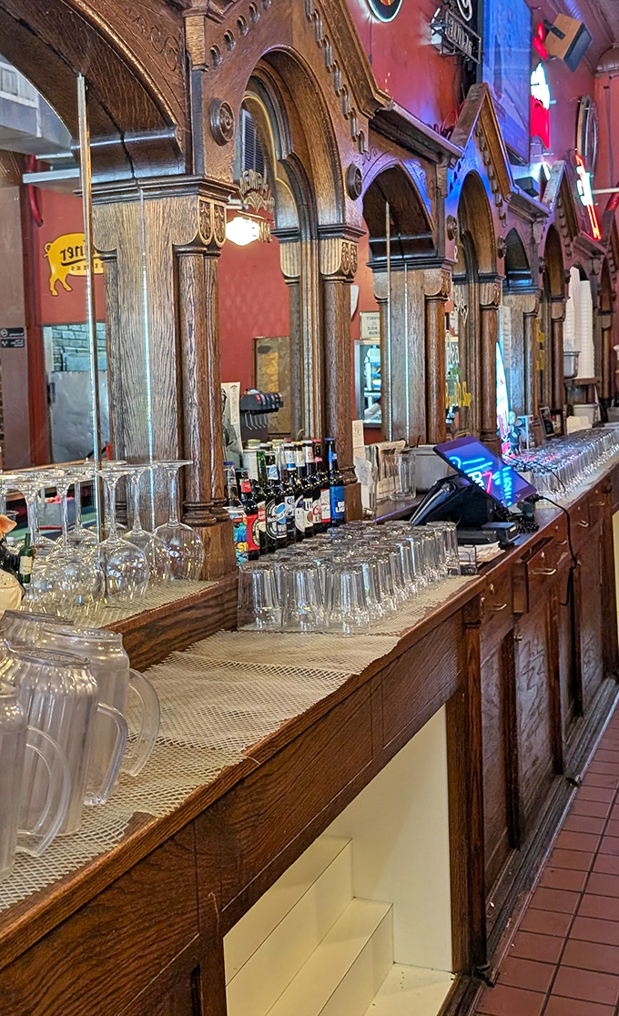 Behind this magnificent wooden bar, barbecue magic happens. The craftsmanship of the woodwork mirrors the artistry of the food.