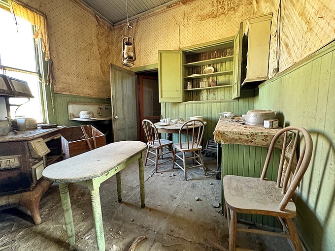 This kitchen's mint-green cabinets have witnessed more family dramas than a soap opera marathon session.