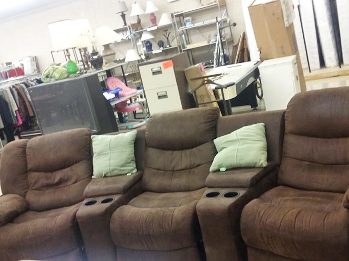 That reclining sectional has cup holders! Perfect for those who believe no movie experience is complete without convenient beverage parking.