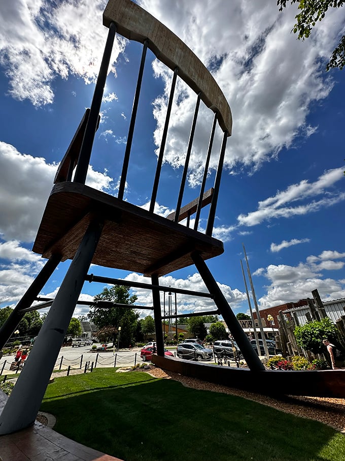 Framed against dramatic clouds, the chair seems almost celestial—as if the sky itself is wondering, "Who ordered this?"
