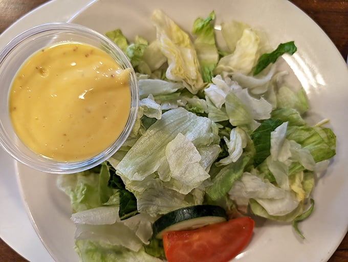 Even the side salad gets special attention here. That house-made dressing isn't just an afterthought—it's liquid gold.